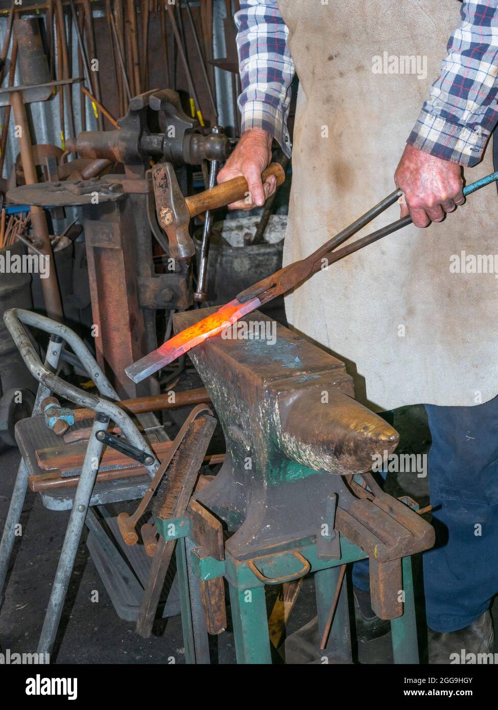 A blacksmith at work on his anvil in Perth, Western Australia Stock ...