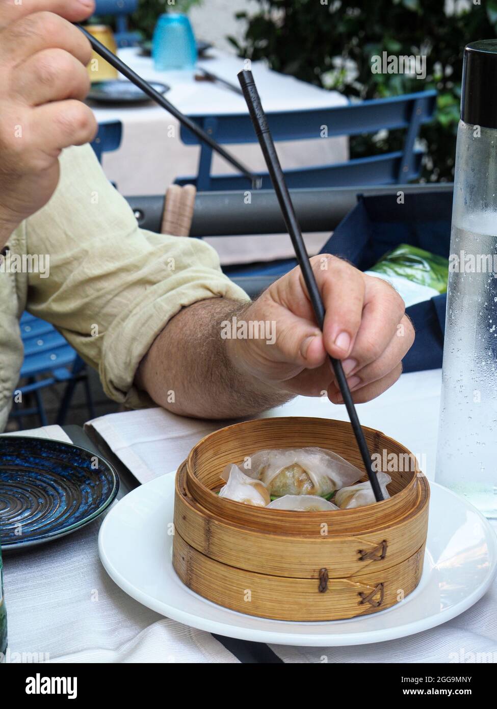 Chopsticks holding a dumpling hi-res stock photography and images - Alamy