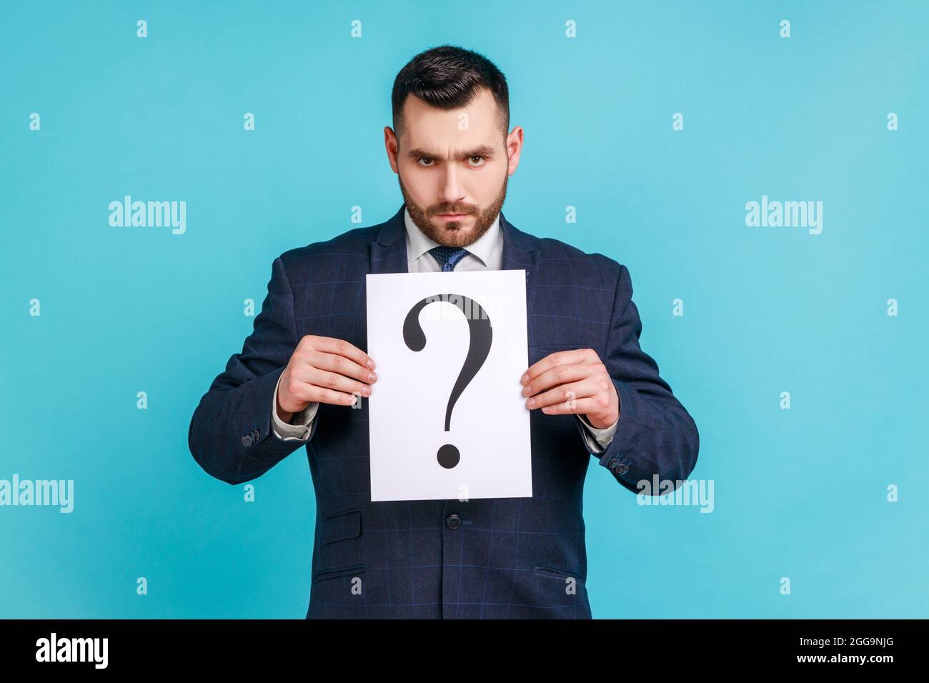 Good looking bearded businessman wearing official style suit question ...