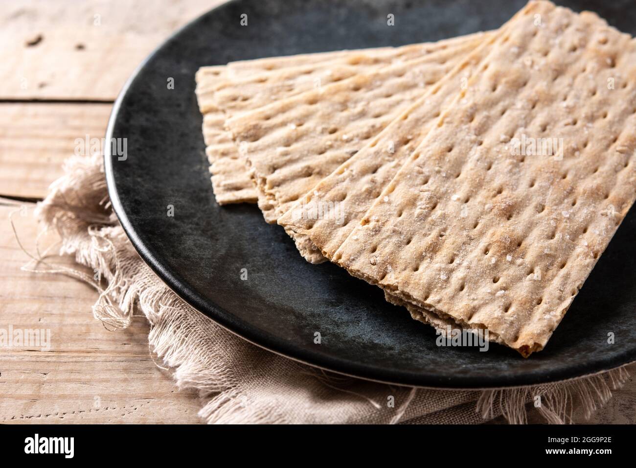 Traditional matzah bread on wooden table Stock Photo - Alamy