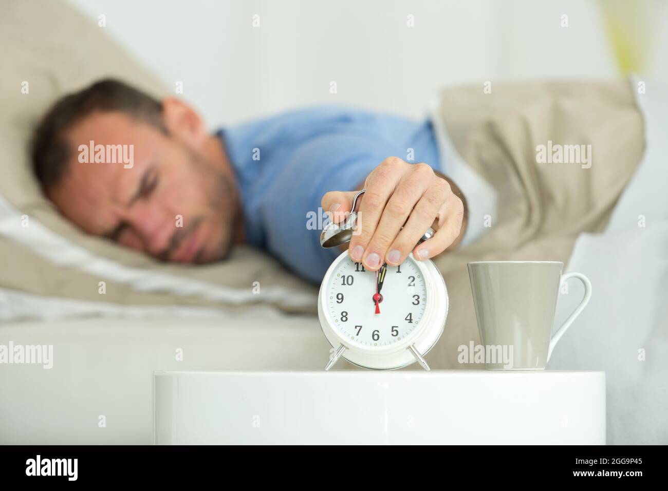 man walking up with the alarm clock Stock Photo - Alamy