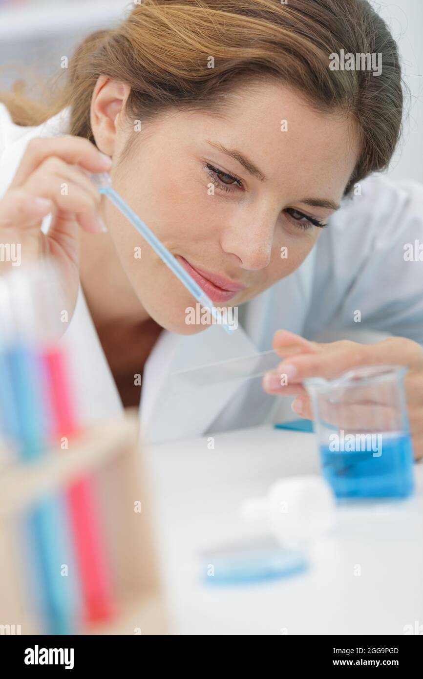 female science researcher using micro pipette in lab Stock Photo - Alamy