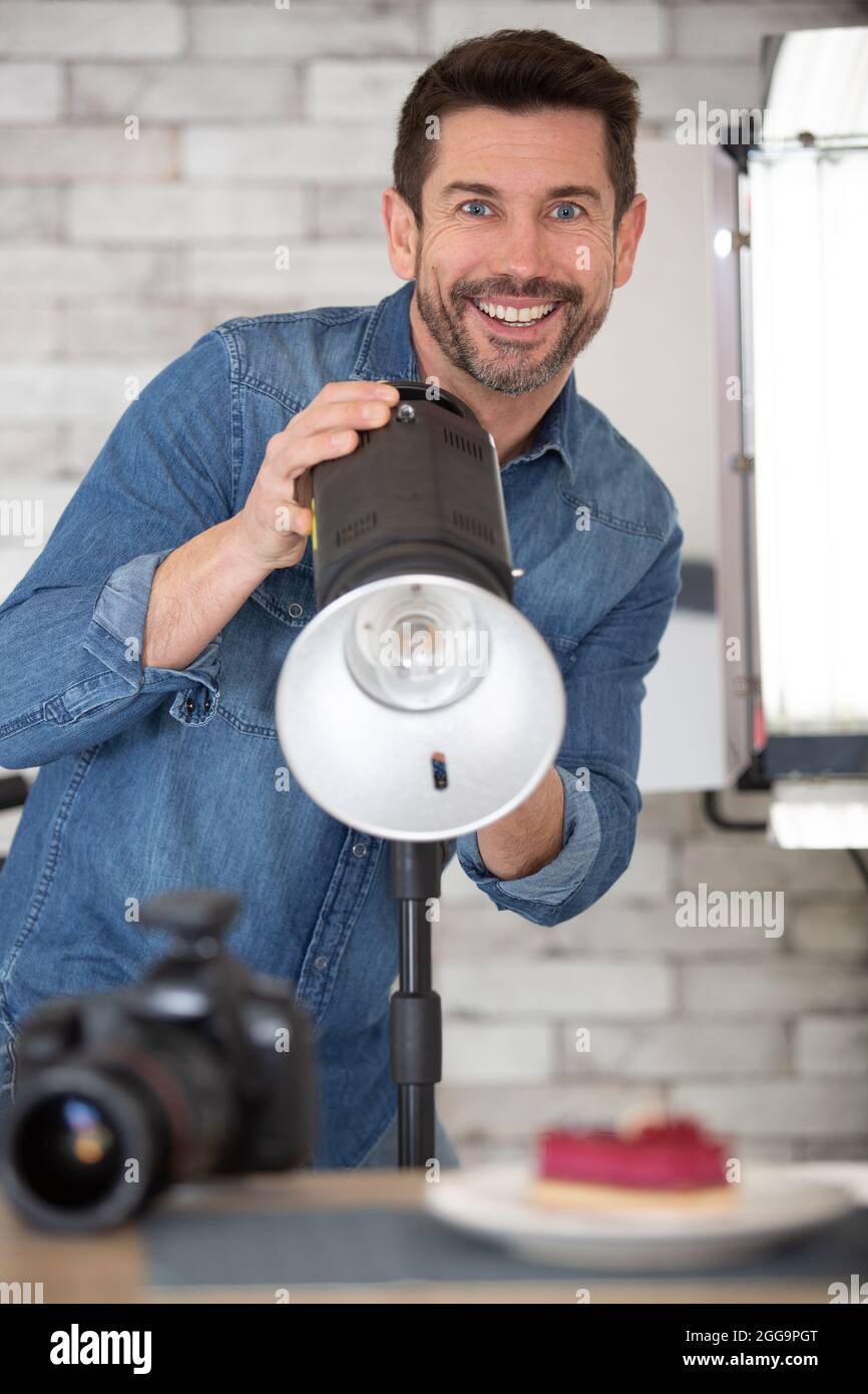 man photographing food in professional photo studio Stock Photo - Alamy