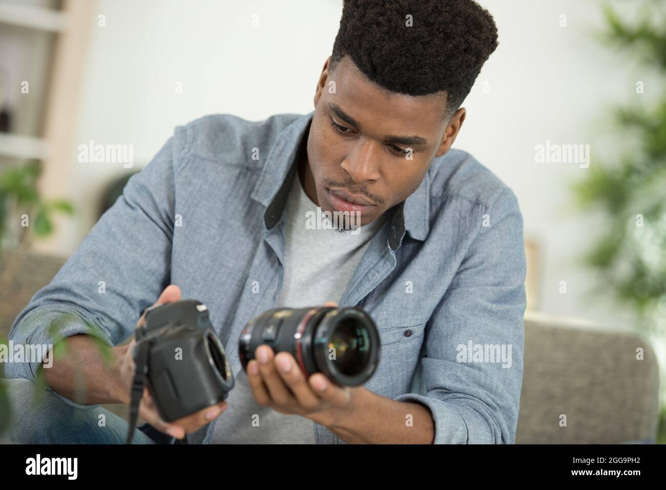 male photographer testing his new camera Stock Photo - Alamy