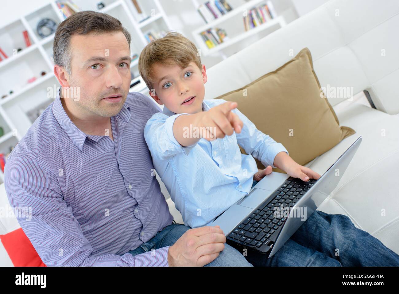 Child with adult, pointing excitedly Stock Photo - Alamy
