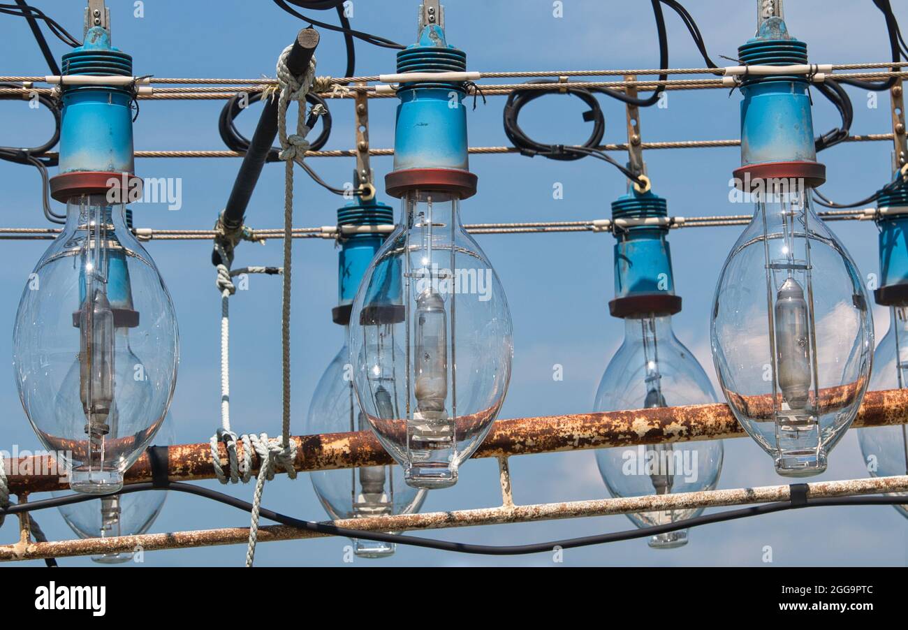 Large, industrial squid boat lightbulbs suspended on wires Stock Photo ...
