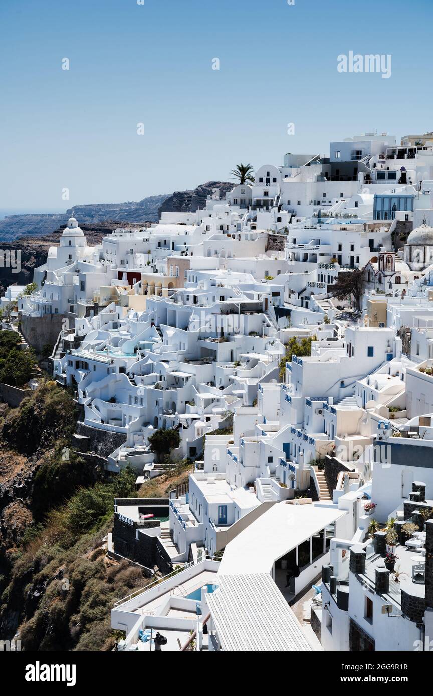 Scenic cityscape of Thira. city on the hill. White architecture ...