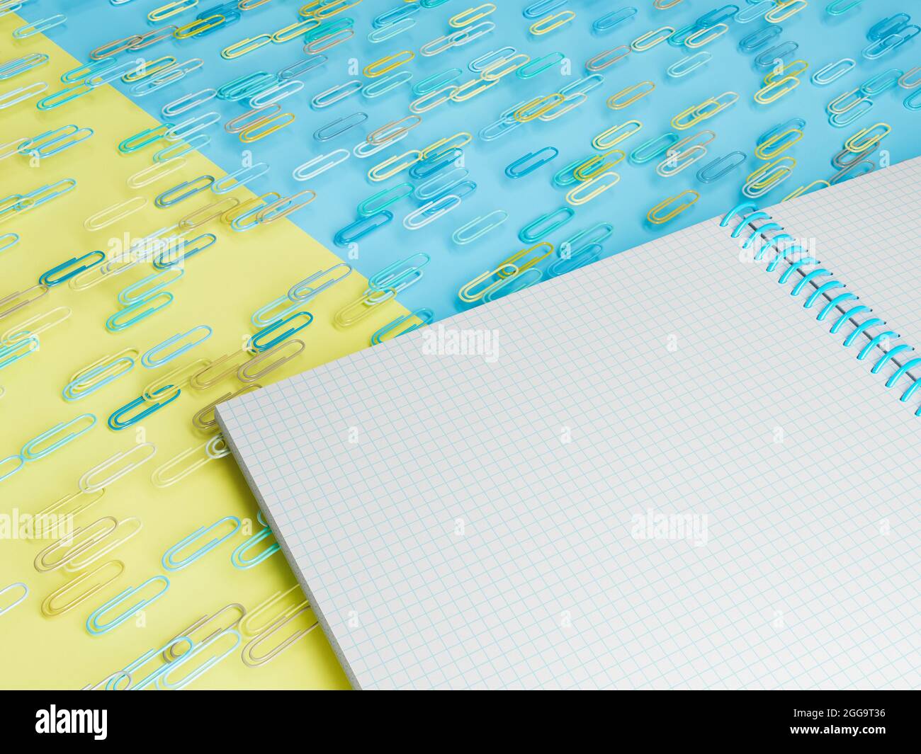 closeup of a notebook corner with many paper clips floating on yellow ...