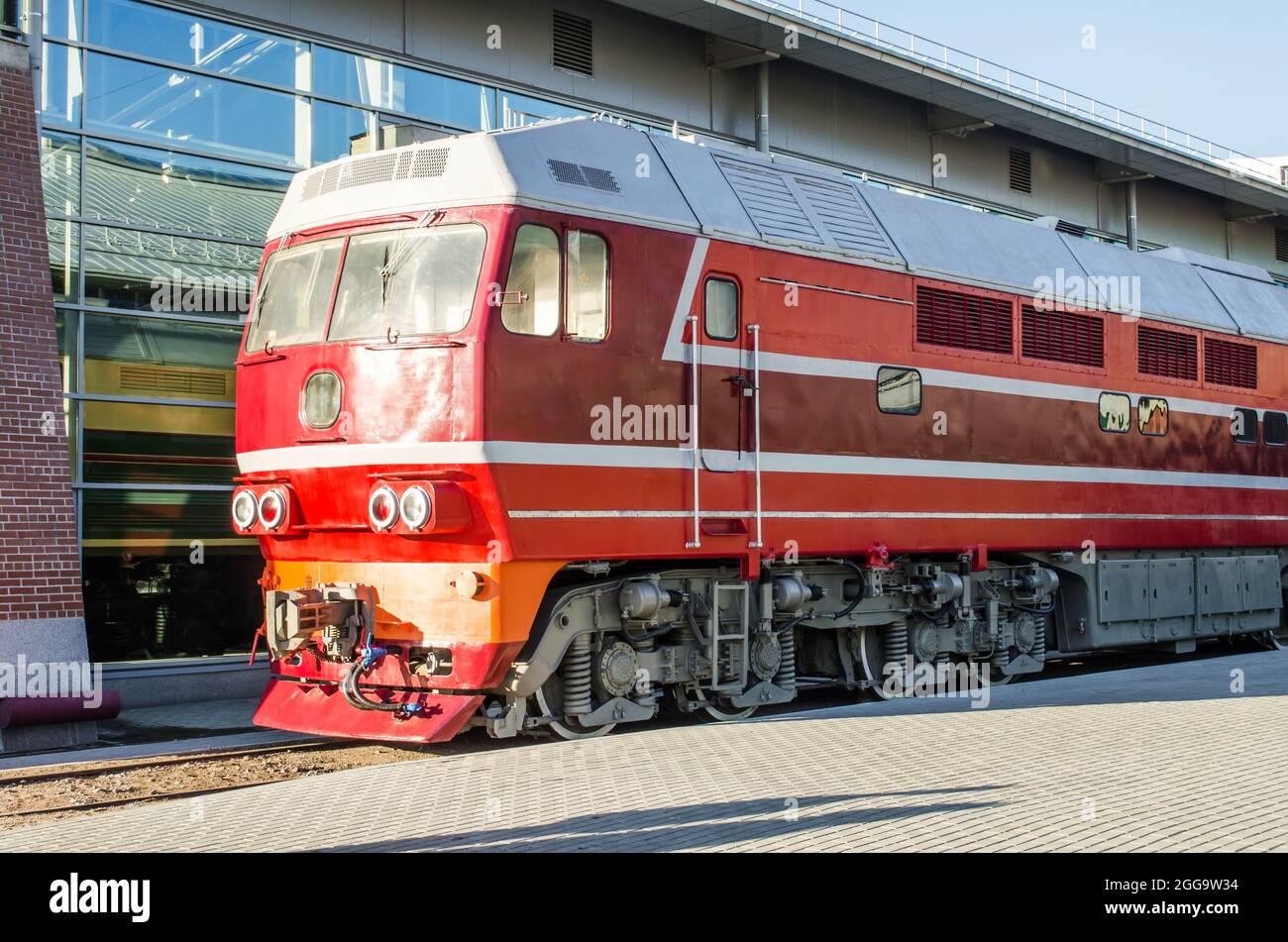 Diesel locomotive on the platform of the railway station Stock Photo ...