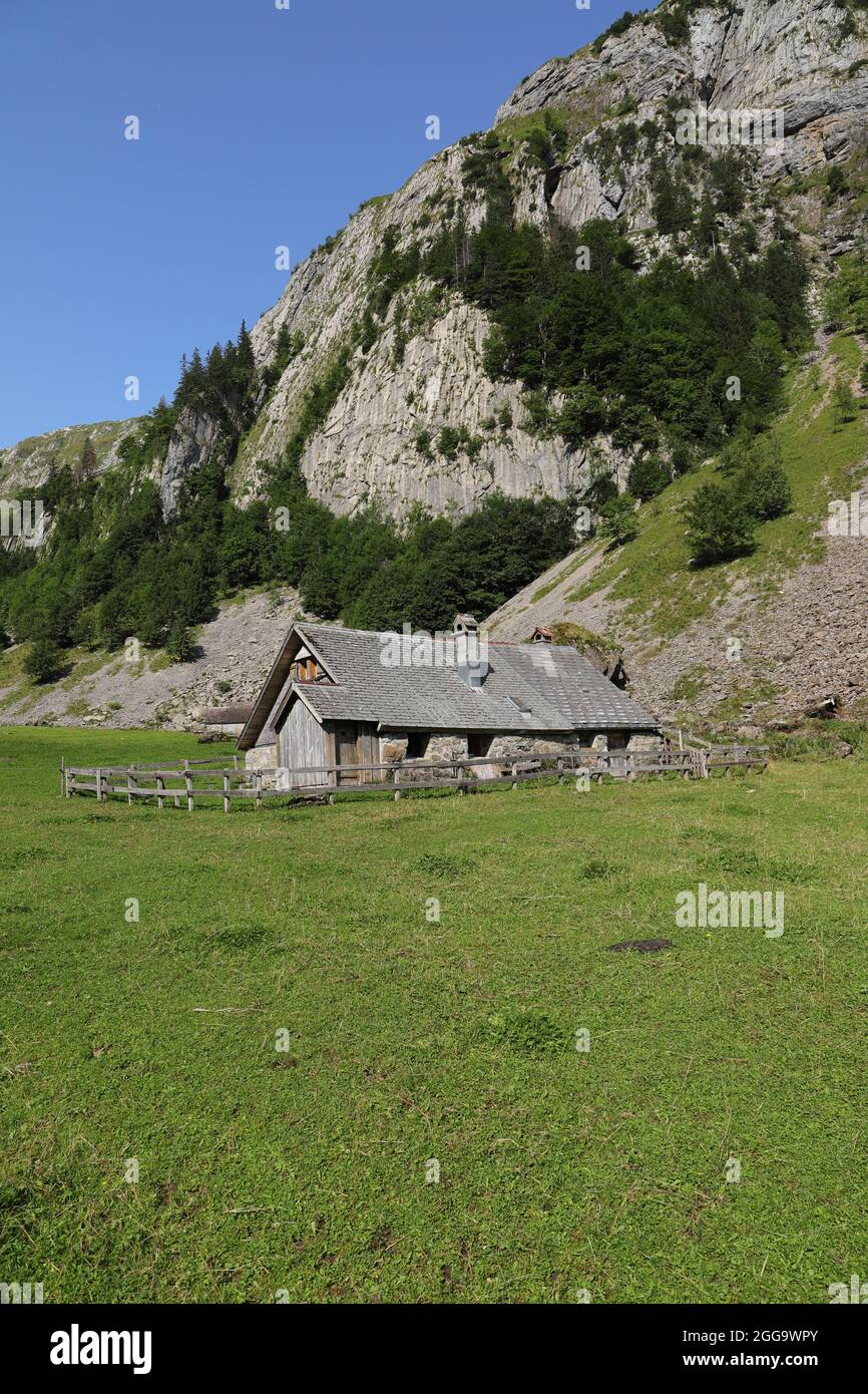 a beautiful swiss alpine landscape with a hut Stock Photo - Alamy