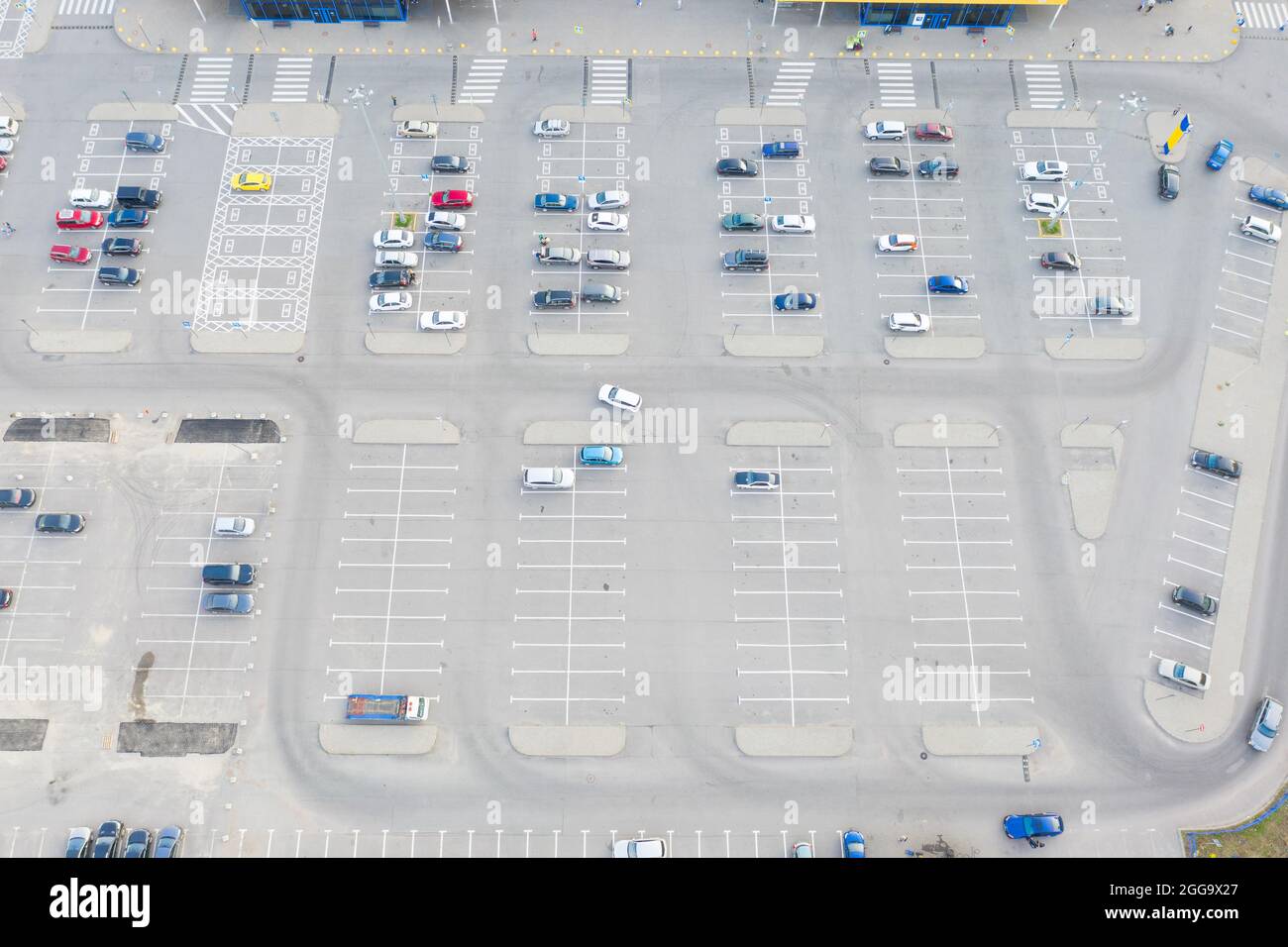 Aerial top down view of the parking lot with many cars of supermarket ...