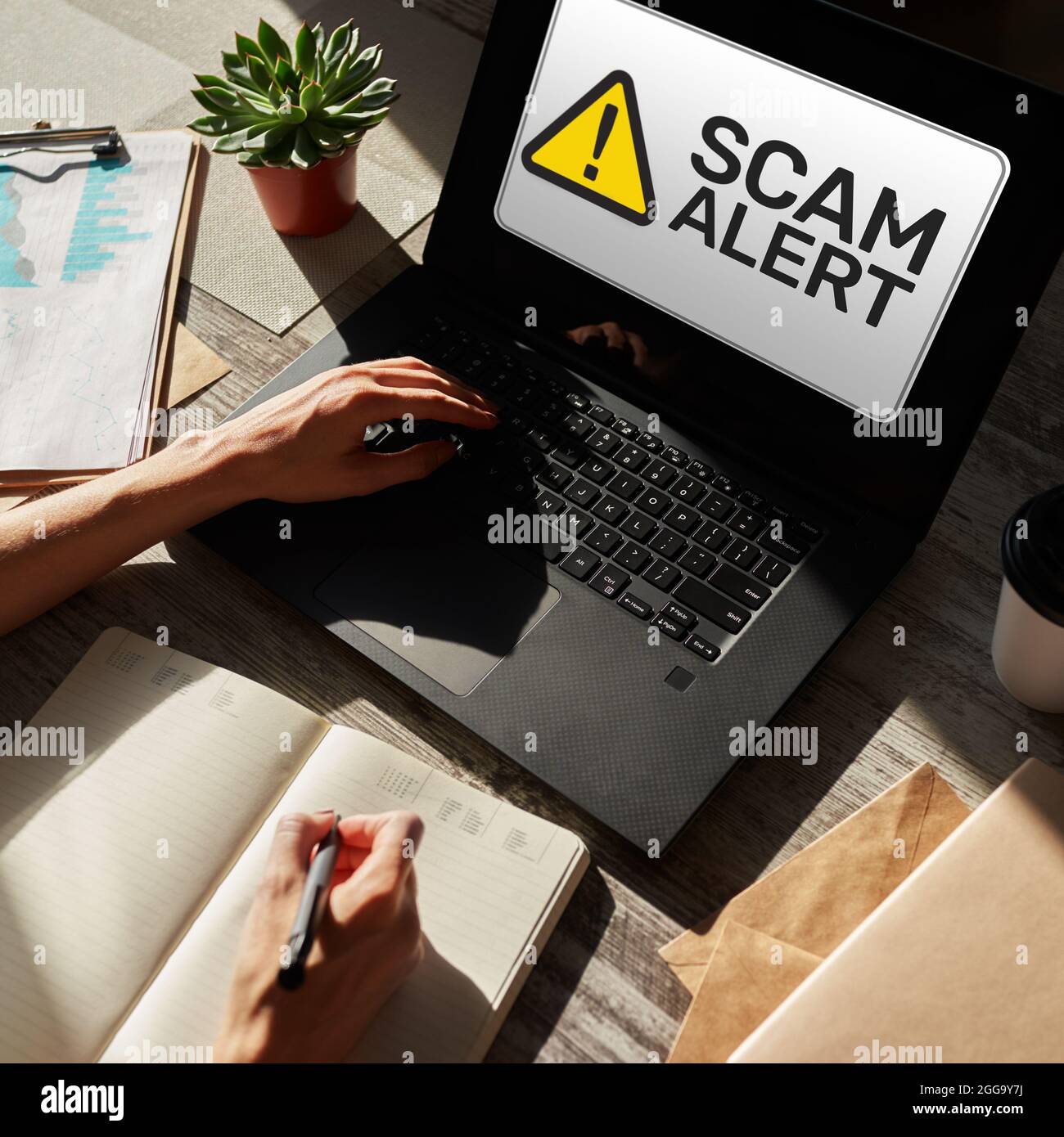 Scam alert detecting warning. Notification on device screen Stock Photo ...