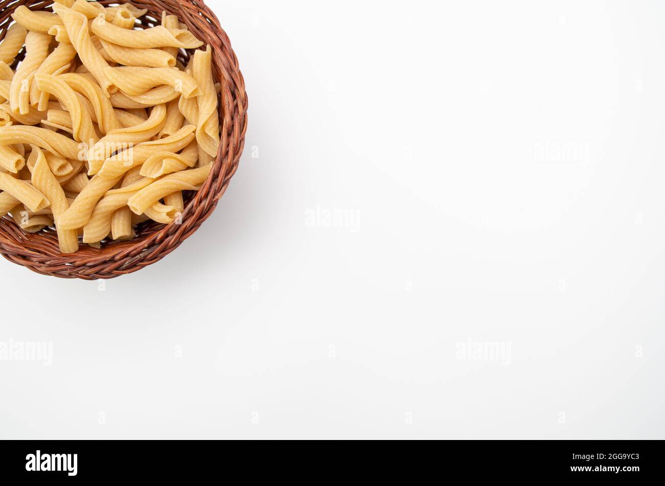 Top view shot of italian pasta in a canister on a white surface Stock ...