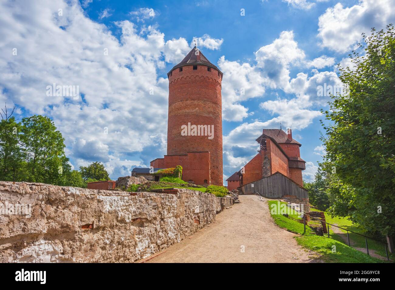 Old Turaida castle with tower in a sunny day. Summer landscape. Gauja ...
