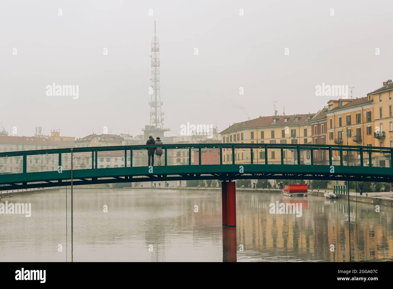 Unrecognisable couple standing on Alexander Langer bridge, Darsena ...