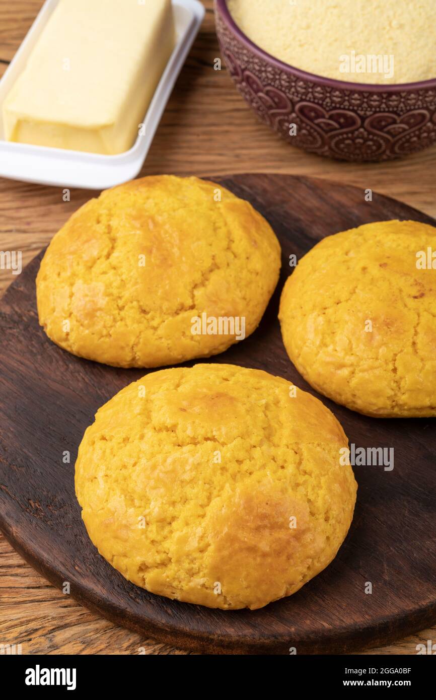 Broa, typical brazilian corn flour bread with ingredients. Butter ...