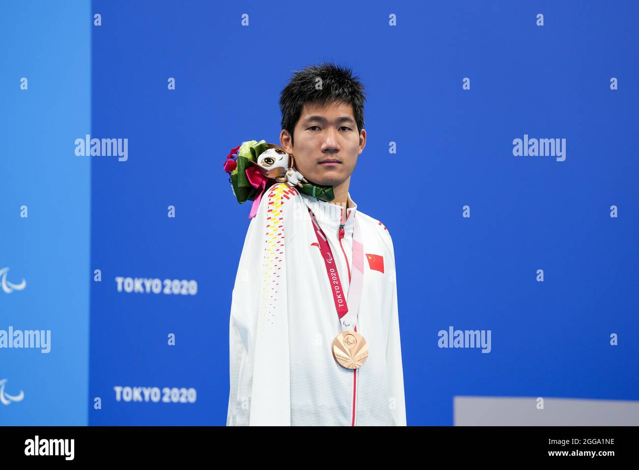 Tokyo, Japan. 29th Aug, 2021. Wang Lichao of China attends the medal ceremony of the men's 50m ...