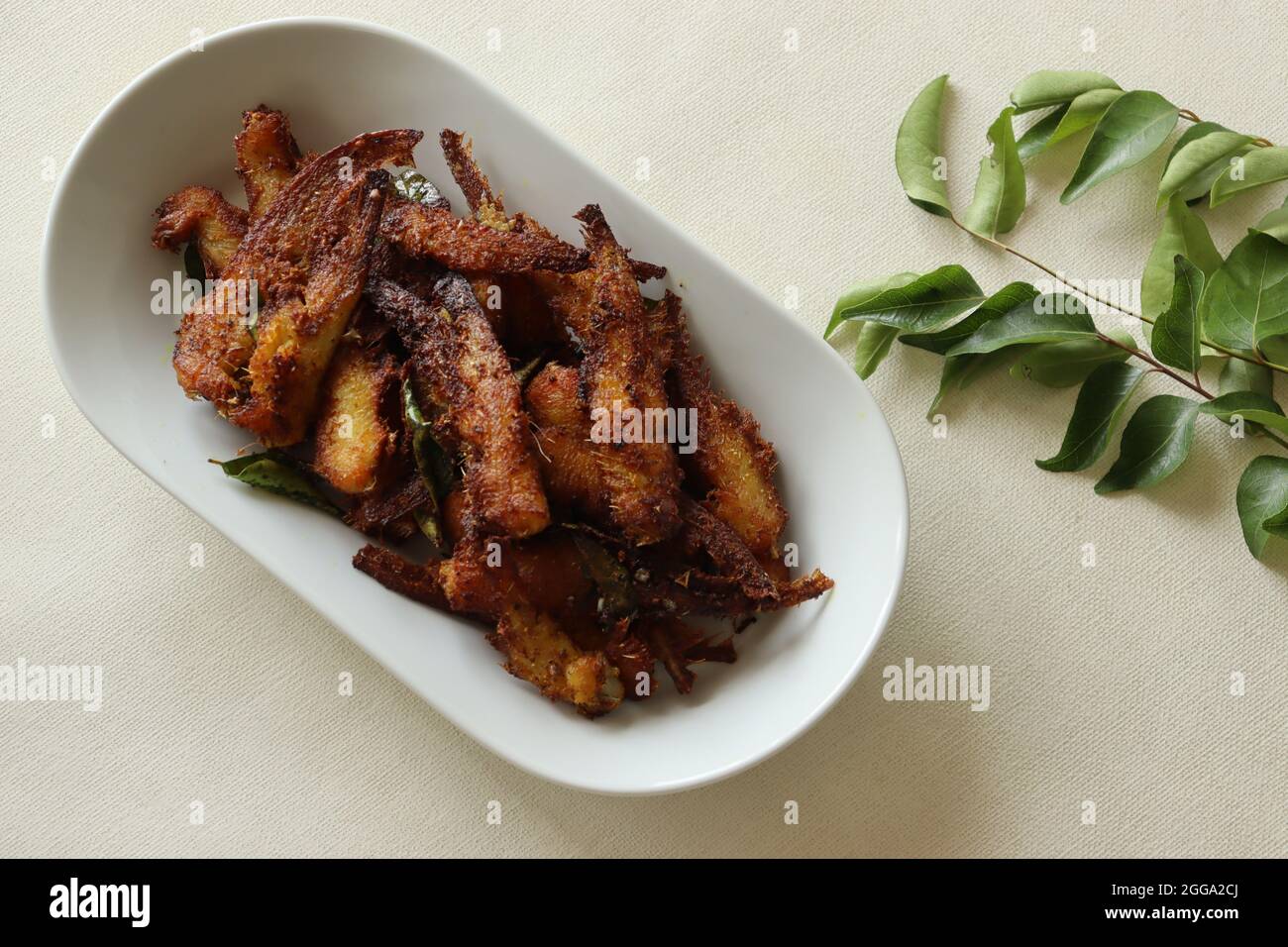 Crispy and spicy Anchovy fry. Anchovies marinated with spices and deep ...
