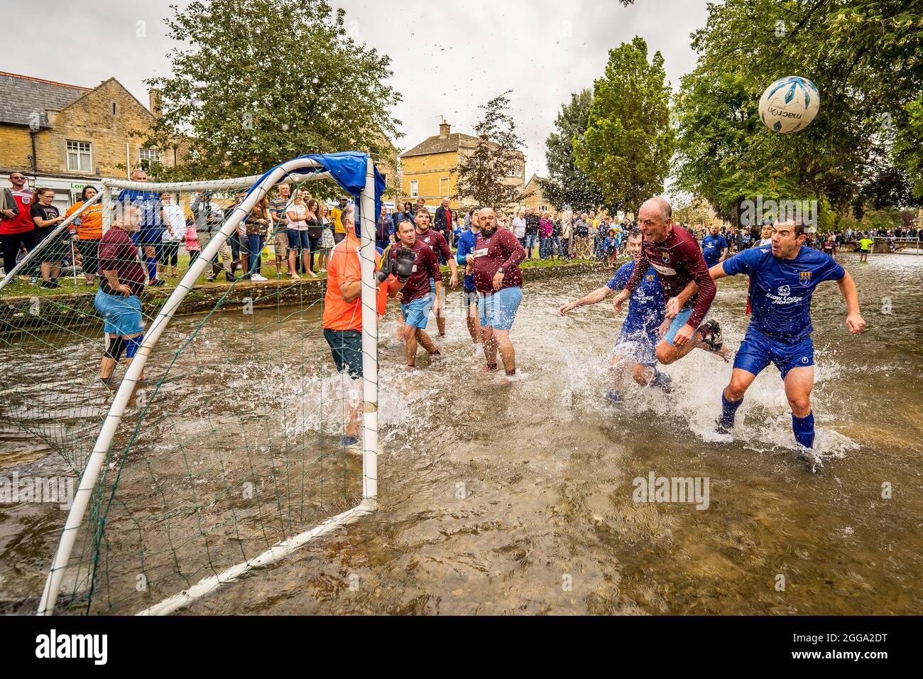 Footballers from Bourton Rovers create a splash as they head the ball ...
