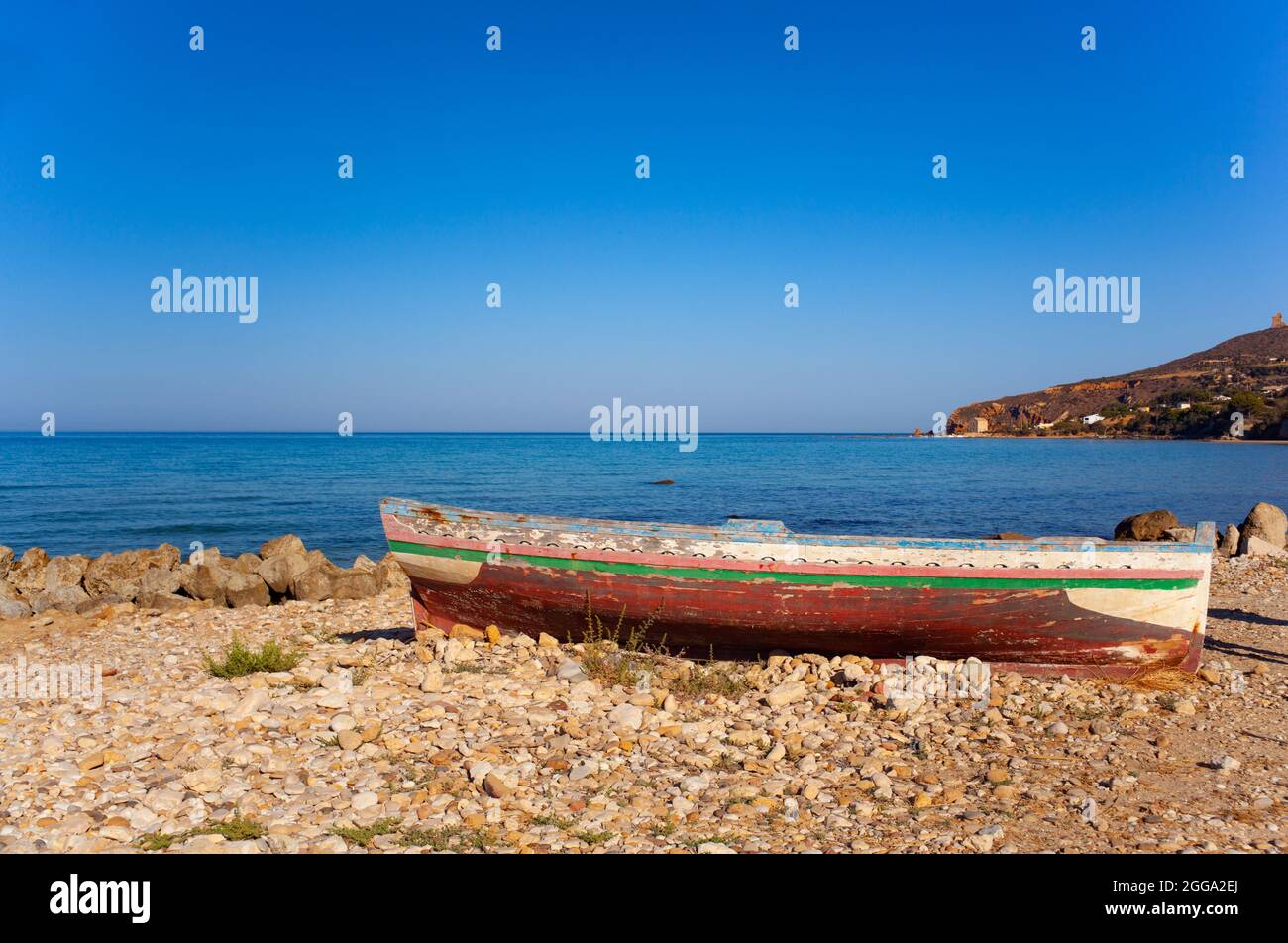 A Broken migrant boat stranded on the beach of the Agrigento coast ...