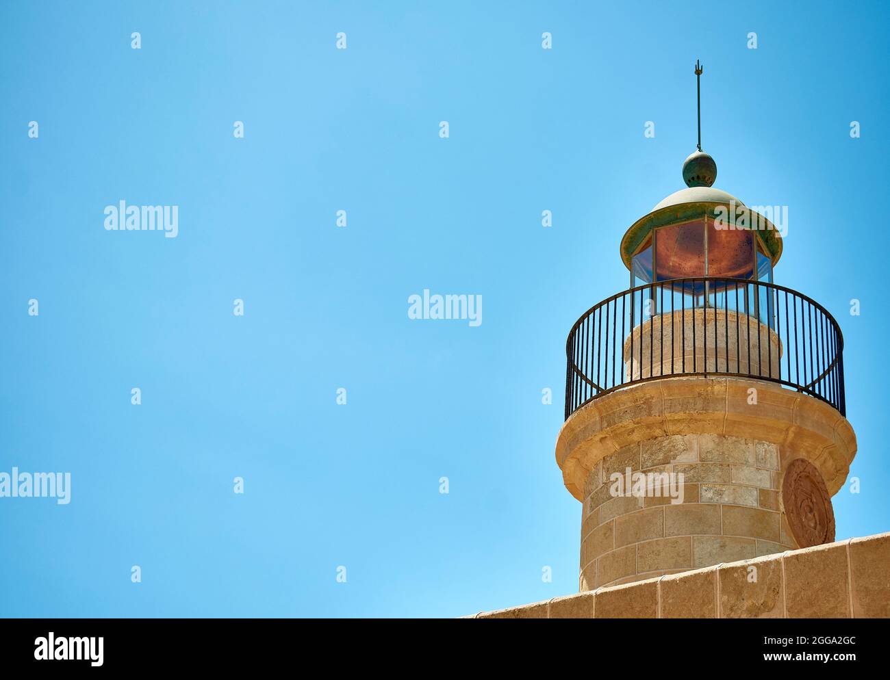 Sea lighthouse with lightning rod in cloudless sky Stock Photo - Alamy