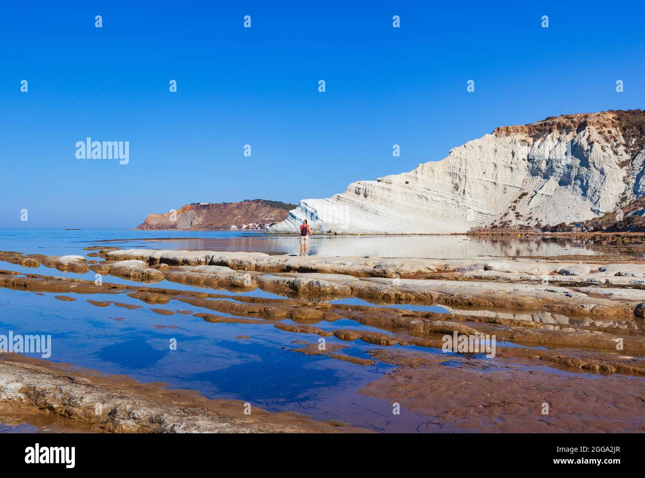 View of the limestone white cliffs with beach at the Scala dei Turchi ...