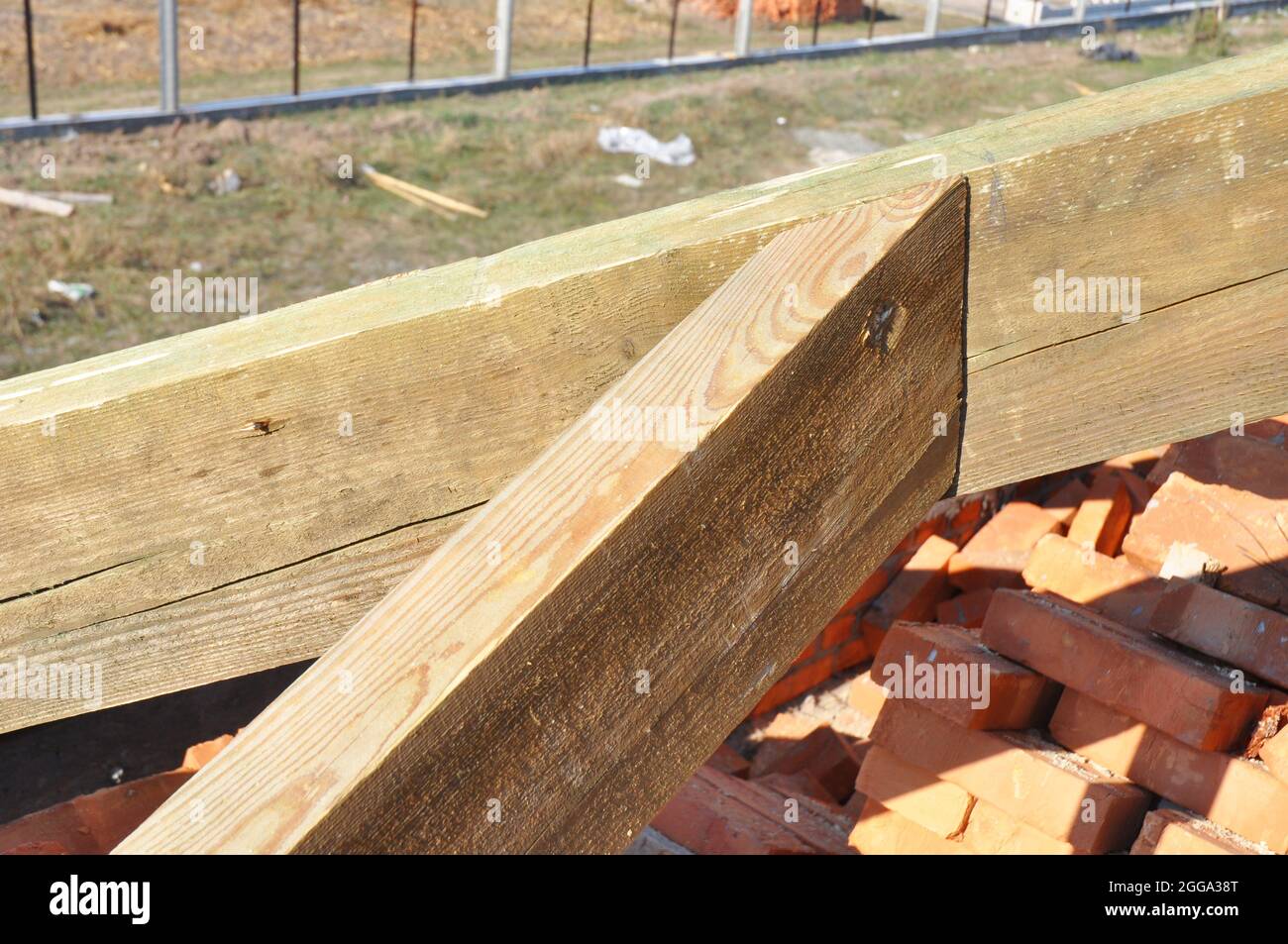 Close-up on the roof framing, installation of two end trusses Stock ...