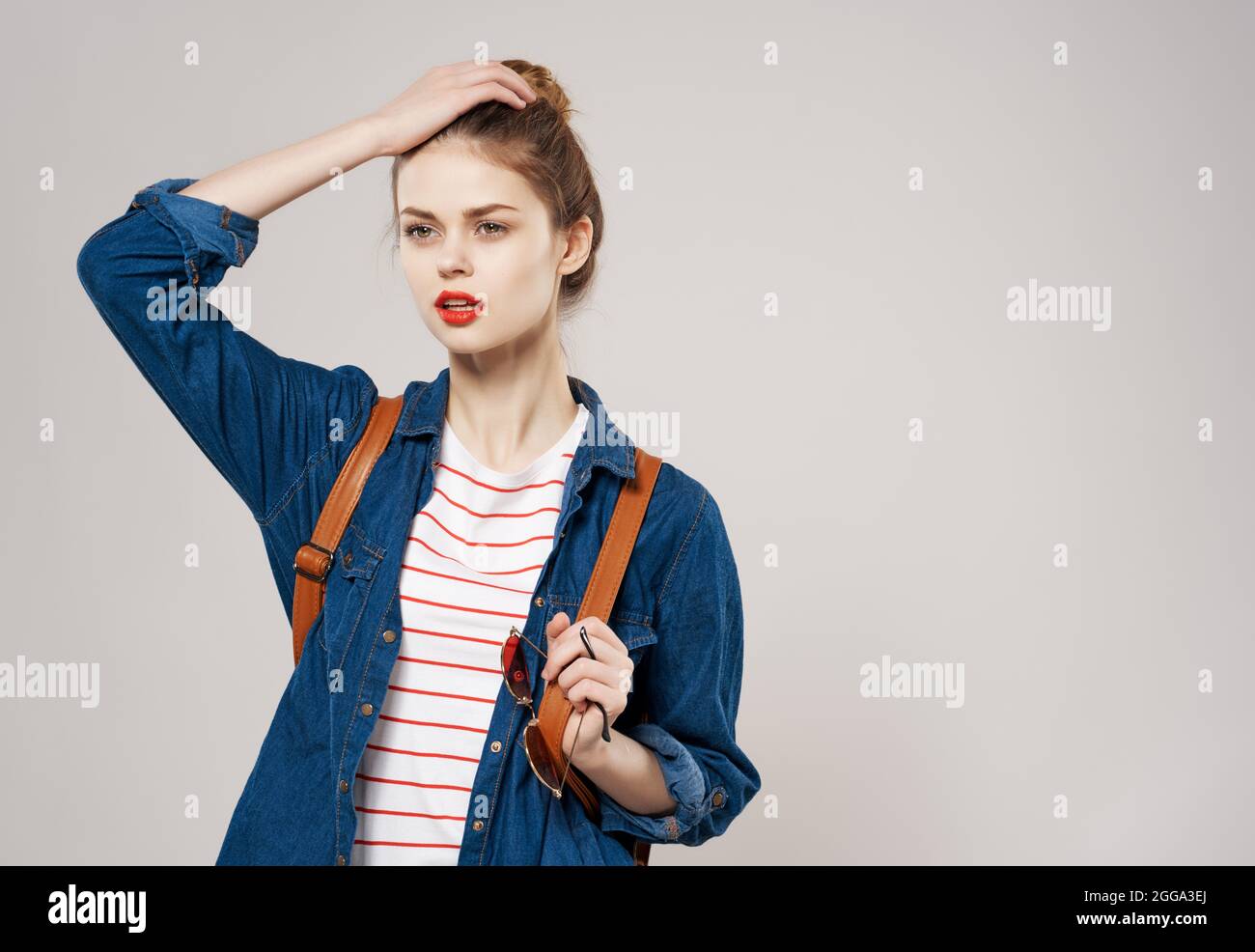 pretty woman student rules fashion light background Stock Photo - Alamy
