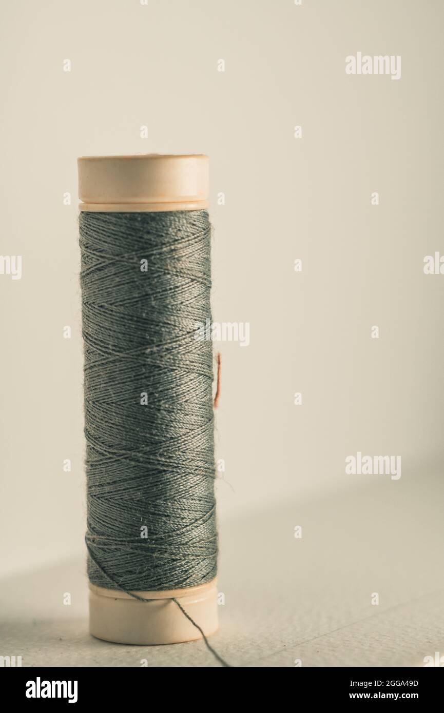 Vertical shot of a roll of gray thread on an isolated background Stock ...