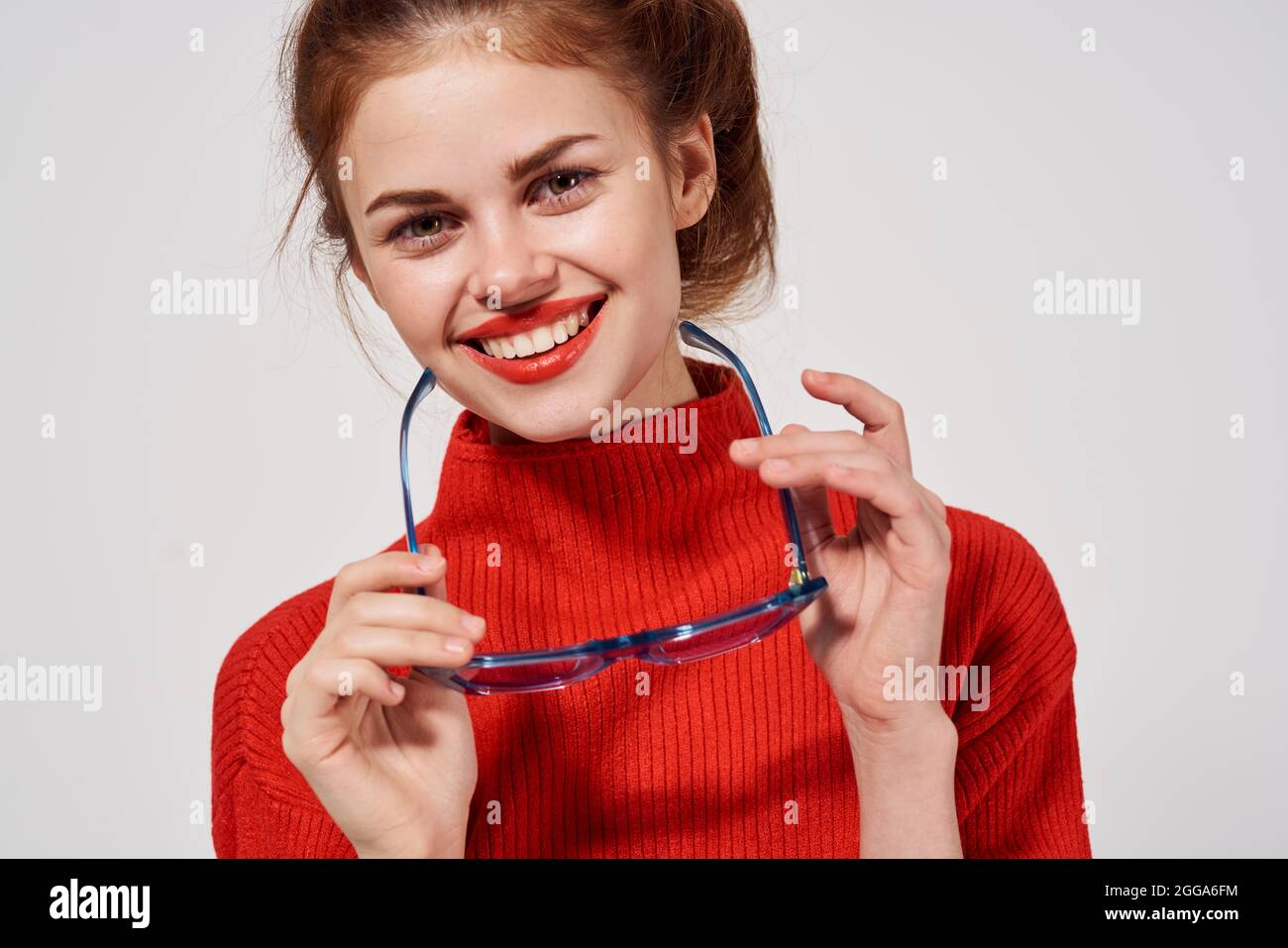 portrait of a woman in a red sweater Lifestyle Studio fun model Stock ...