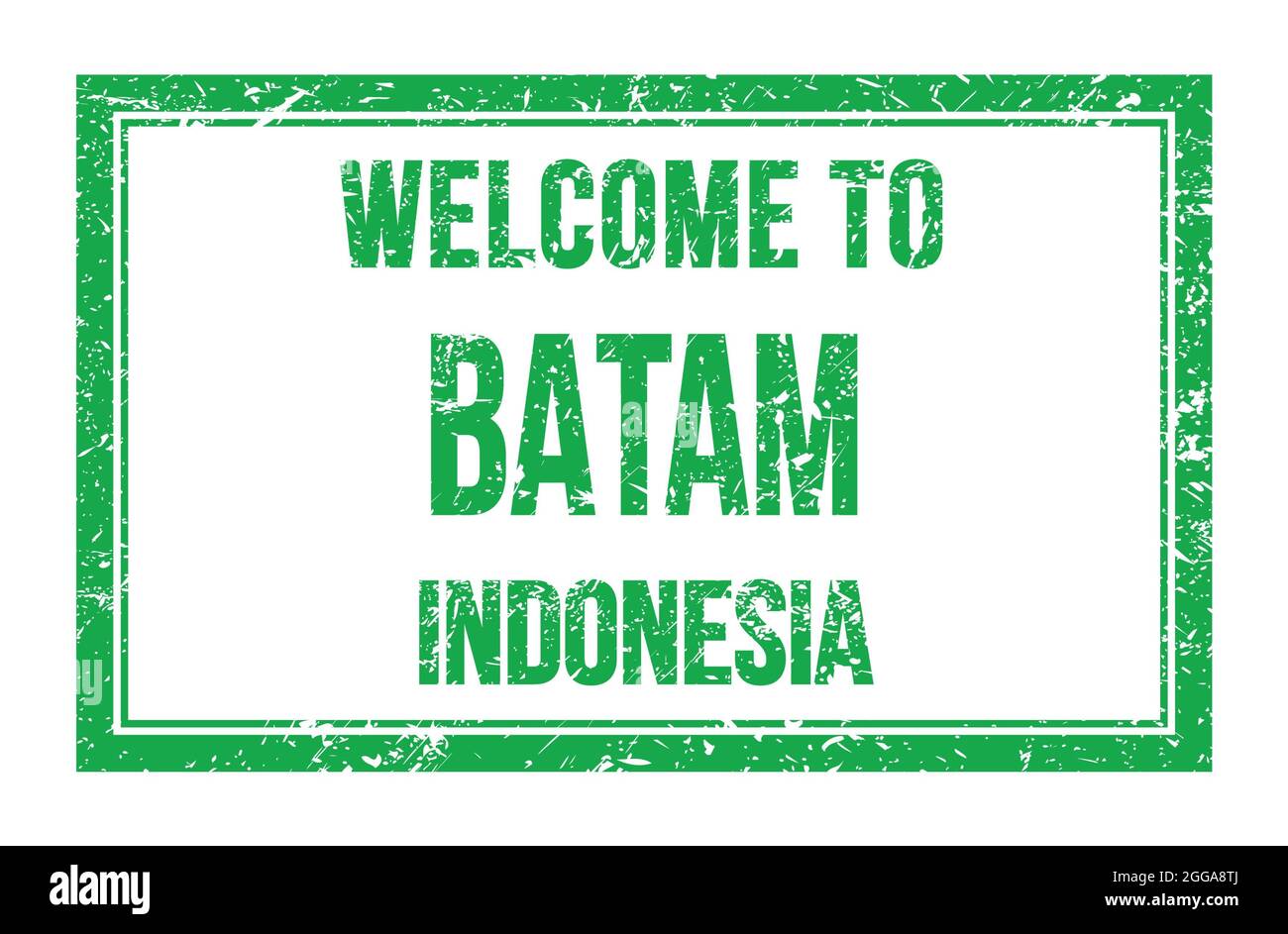 WELCOME TO BATAM - INDONESIA, words written on green rectangle post ...