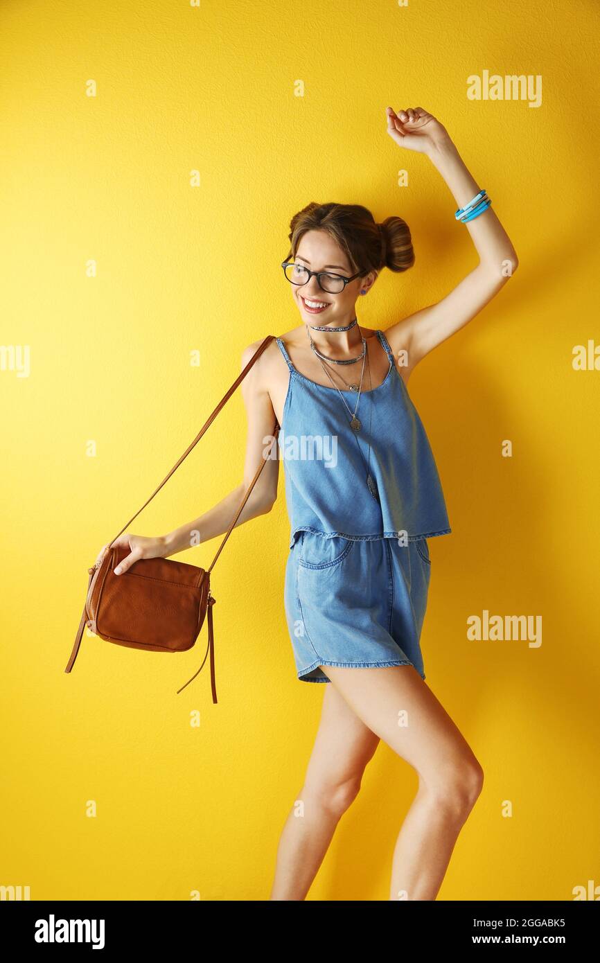 Beautiful girl on yellow background Stock Photo - Alamy