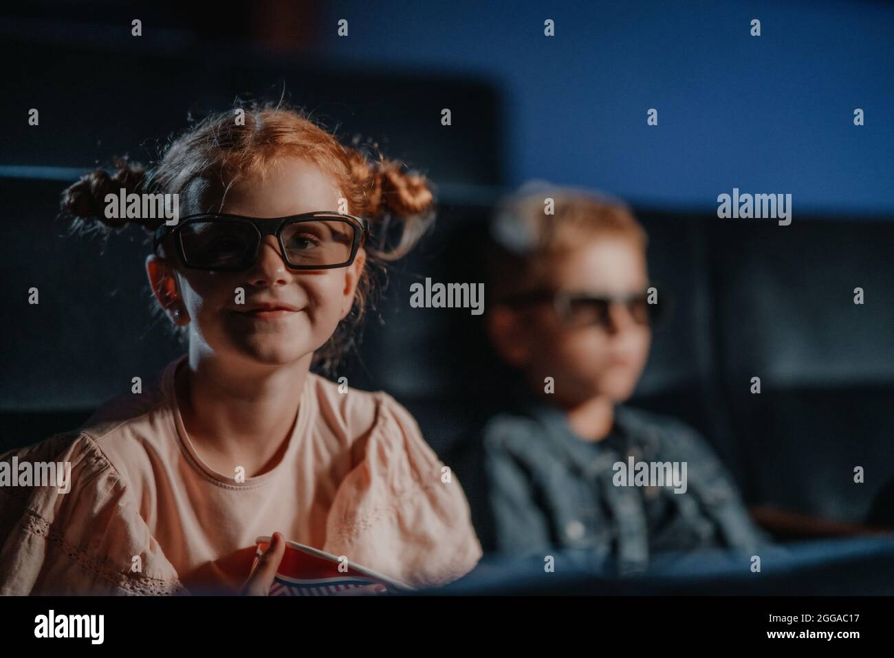 Small children with 3d glasses in the cinema, watching film Stock Photo ...