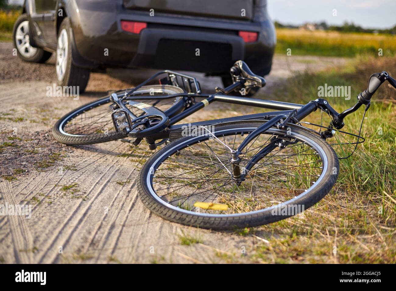 Photo of car and bicycle on the road Stock Photo - Alamy