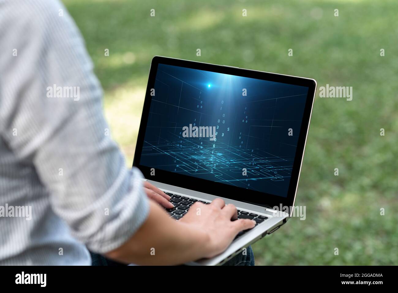 Woman Busy Typing On Laptop Sitting Outside Her Garden Back View ...