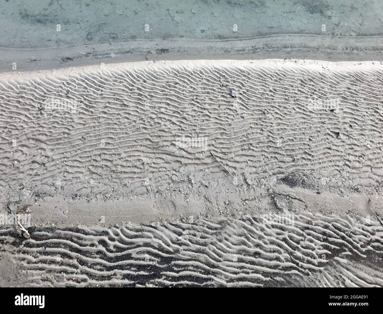 Natural view of wave patterns on the sand during low tide Stock Photo ...