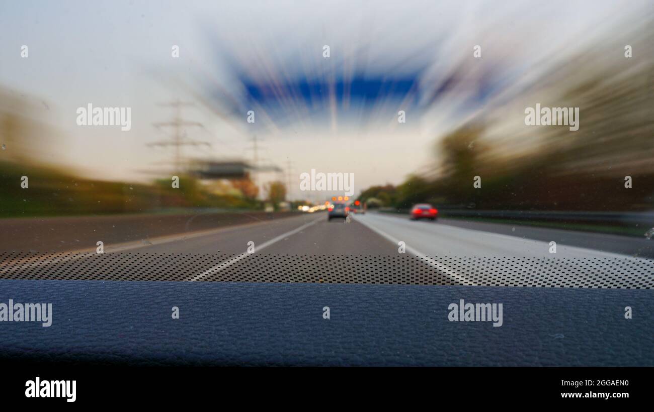 Fast paced highway with cars driving along it Stock Photo - Alamy