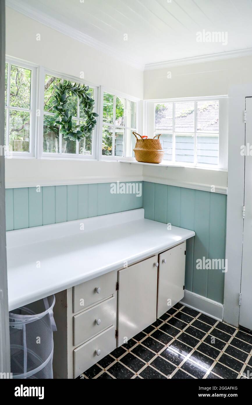 A vintage laundry room filled with windows and natural light Stock ...