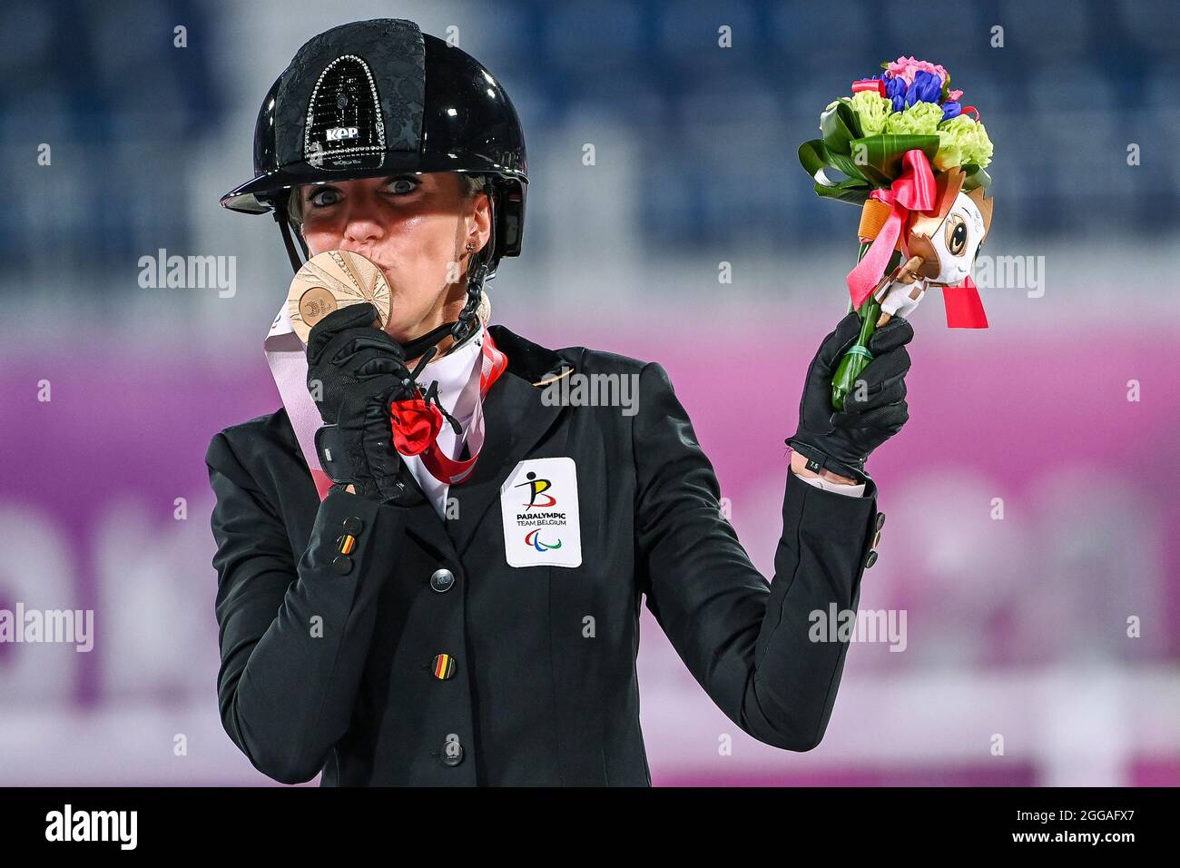 Belgian Paralympic jockey Manon Claeys celebrates on the podium after ...