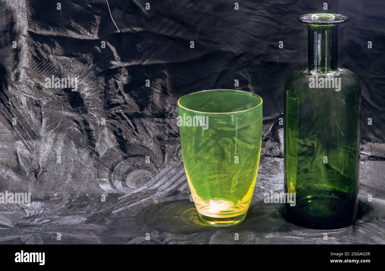 Colored transparent green glass cup and green glass bottle for water ...