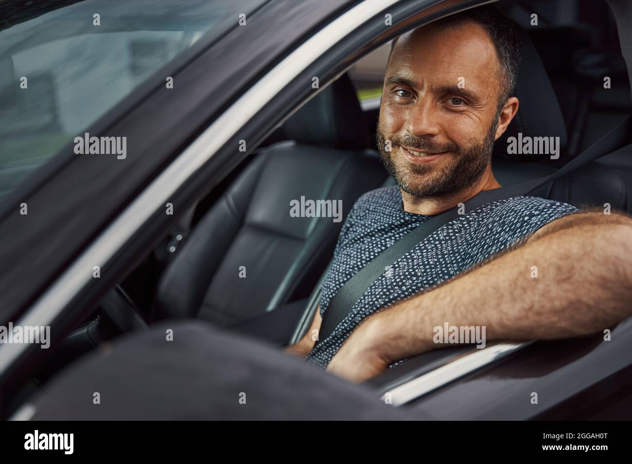 Confident smiling driver following safety rules and measurements Stock ...
