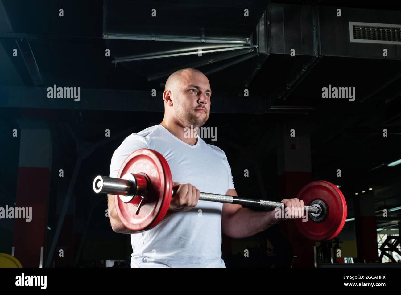 Young athlete lifts heavy barbell hi-res stock photography and images ...