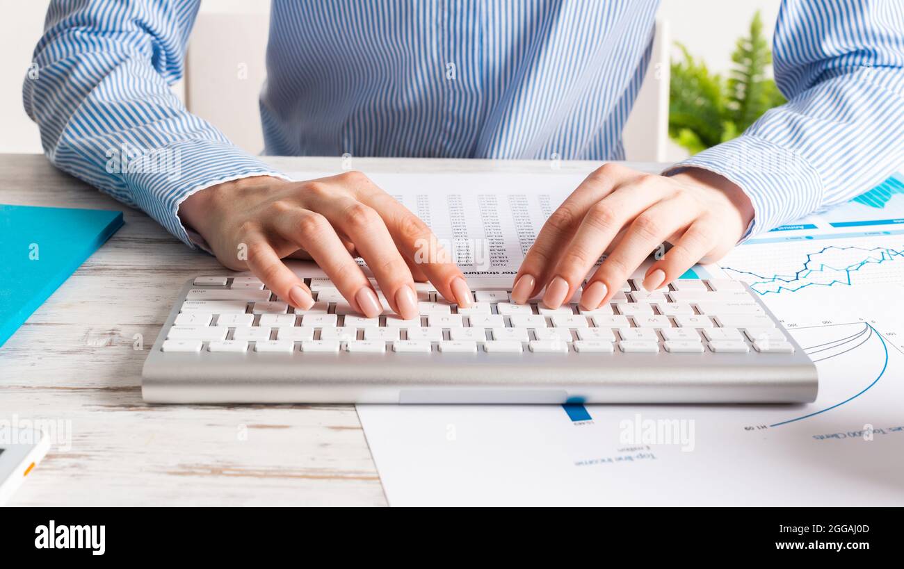 Manager typing on computer keyboard Stock Photo - Alamy