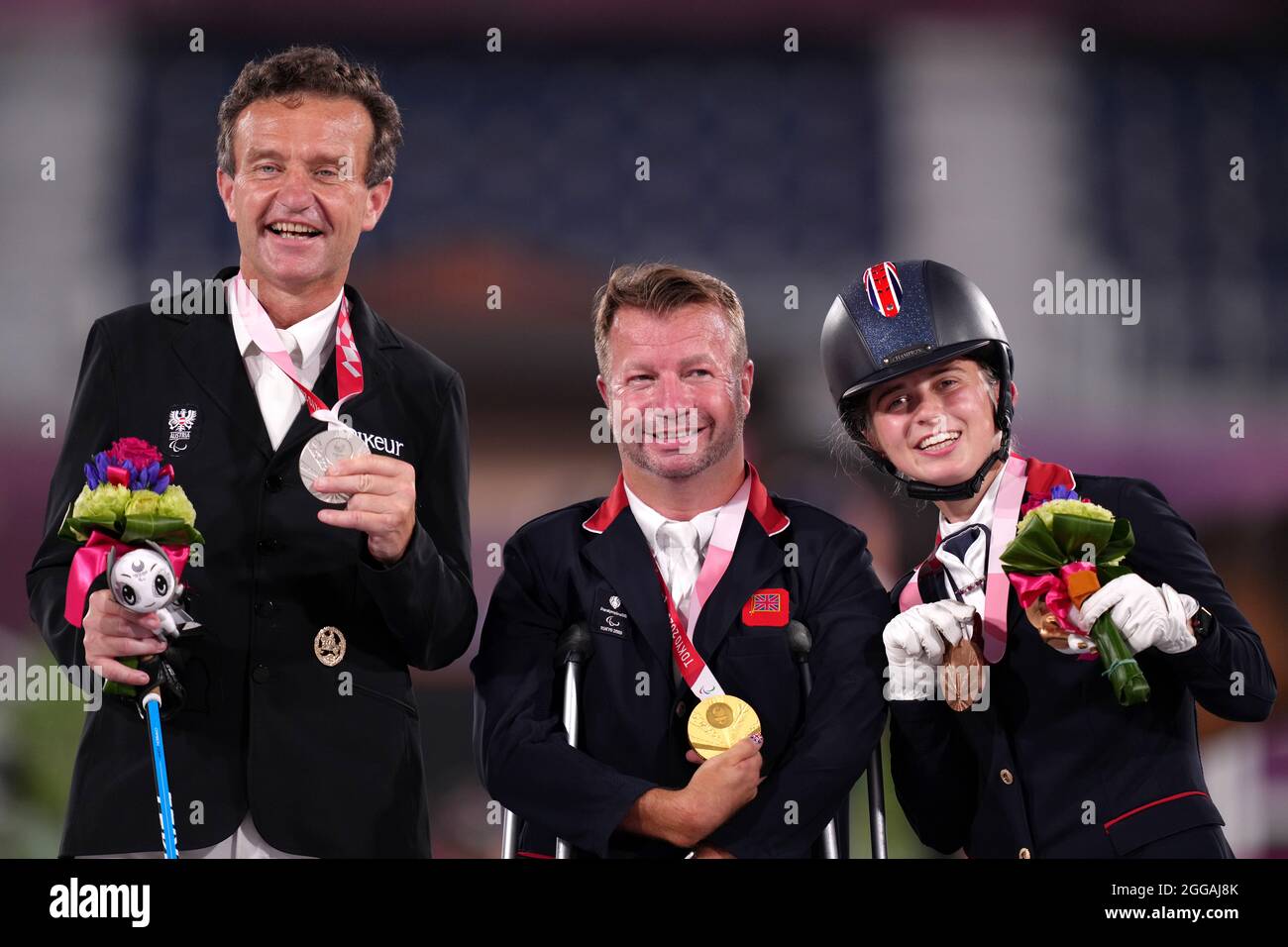 Great Britain's Lee Pearson (centre) celebrates with the gold medal ...