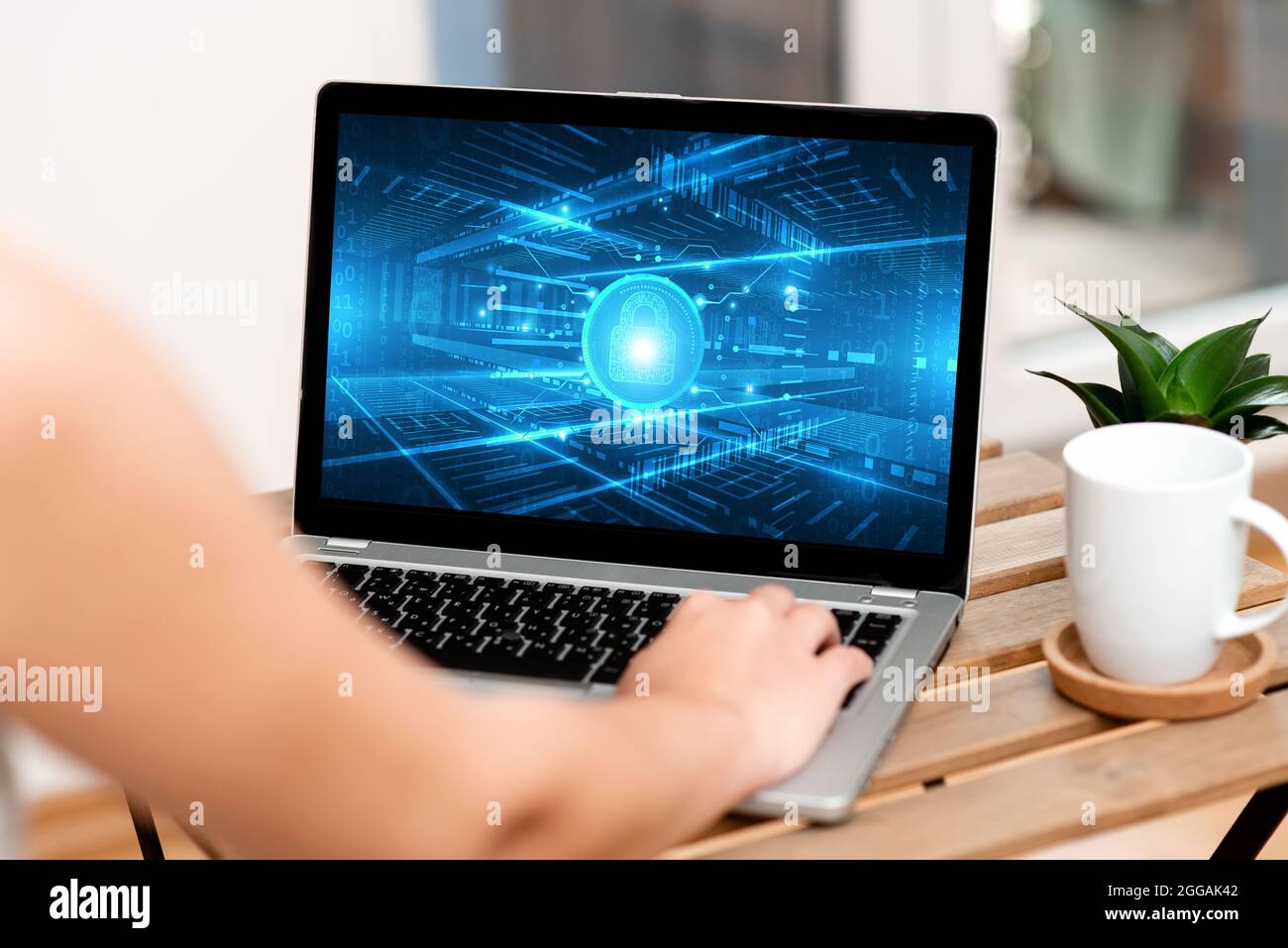 Hand Busy Typing On His Laptop Beside Coffe Mug And Plant Accomplishing ...