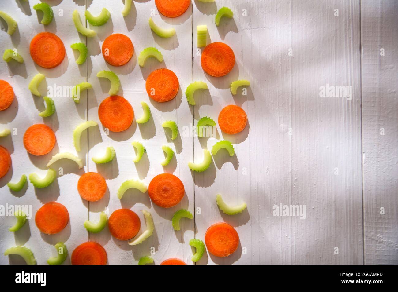 Presentation of vegetables celery and carrots cut into small slices ...