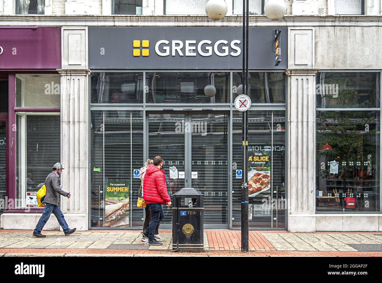 Shoppers seen walking past the Greggs Hot Food Store, in Royal Avenue ...