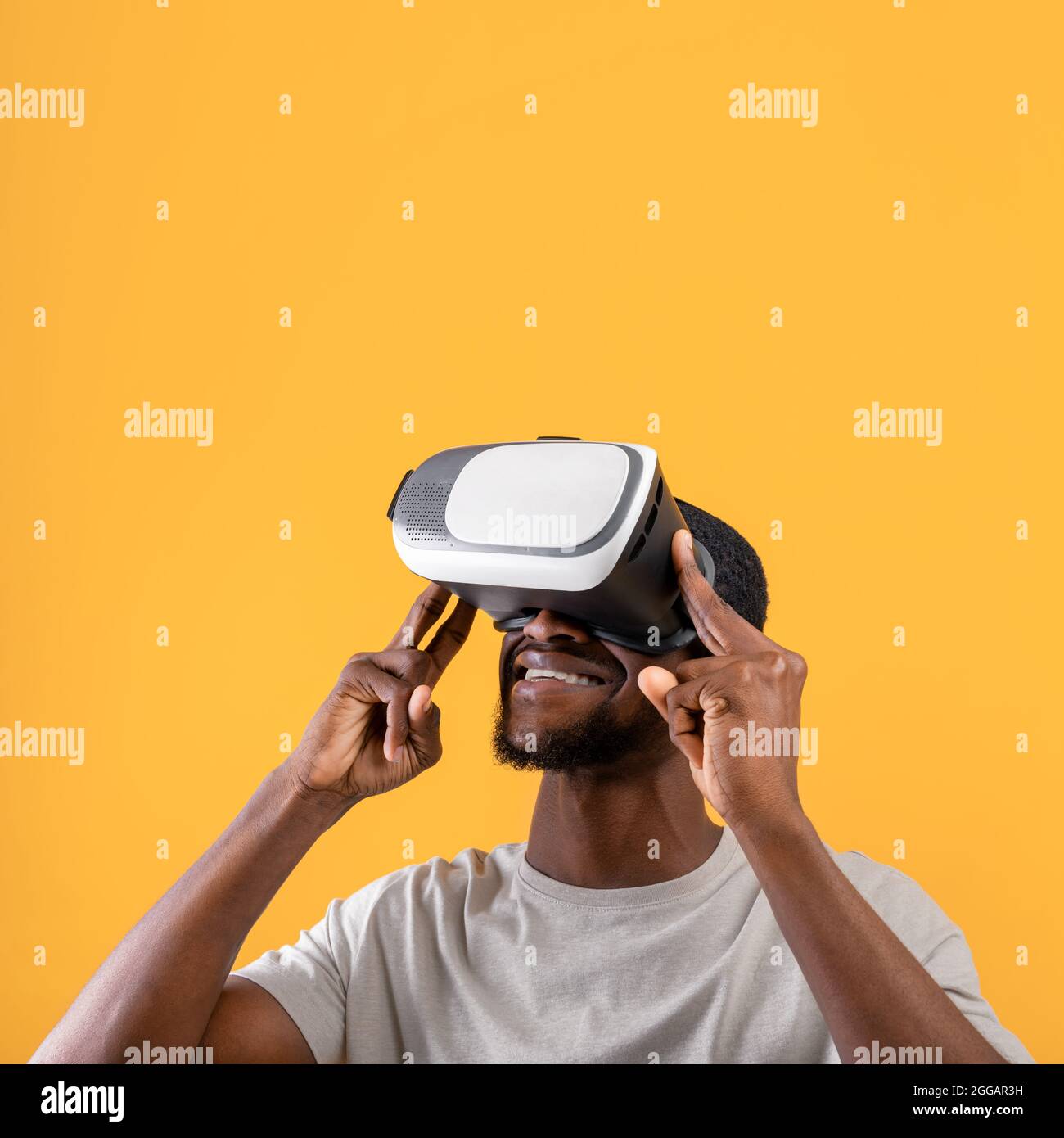 Experiencing futuristic technologies. African american man wearing VR ...
