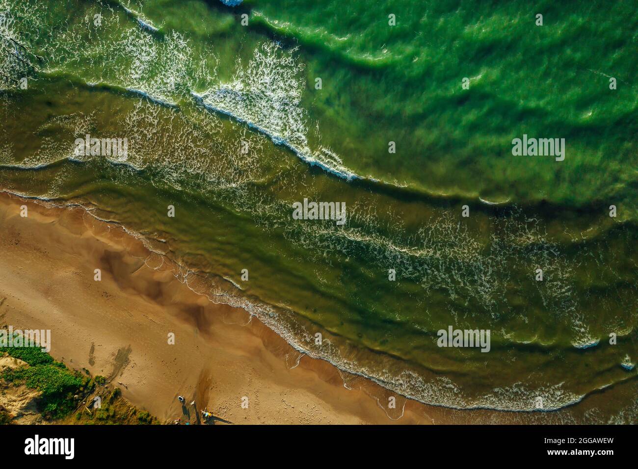 Top view shot of a beach being washed off by the waves of a sea Stock ...