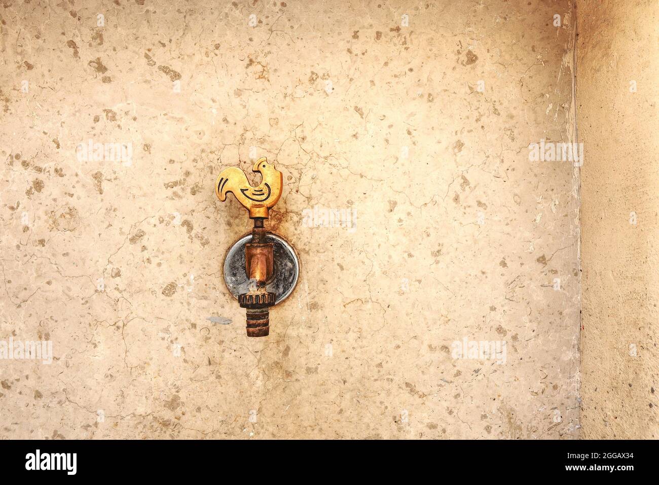 close up of a water tap in a wall Stock Photo - Alamy